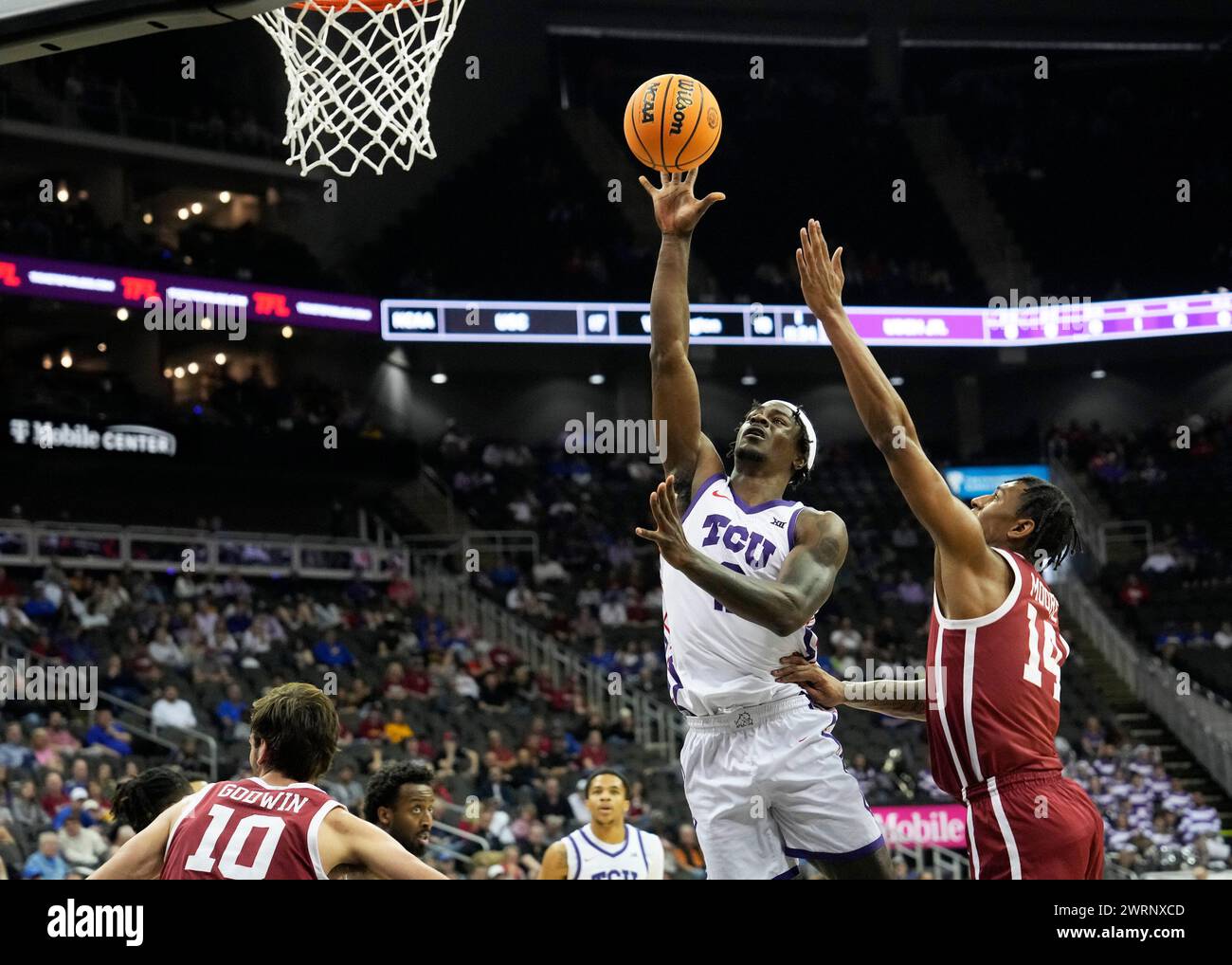 MAR 13 2024: TCU Horned Frogs forward Emanuel Miller (2) puts up a shot ...
