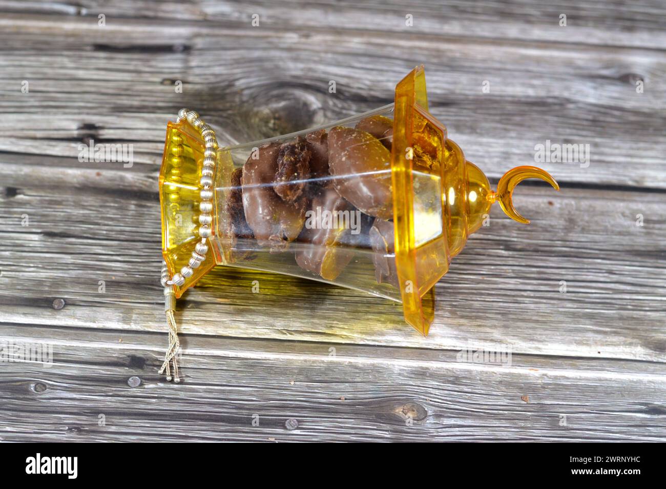 Islamic lantern fanous, silver rosary and chocolate-Covered Dates make ...