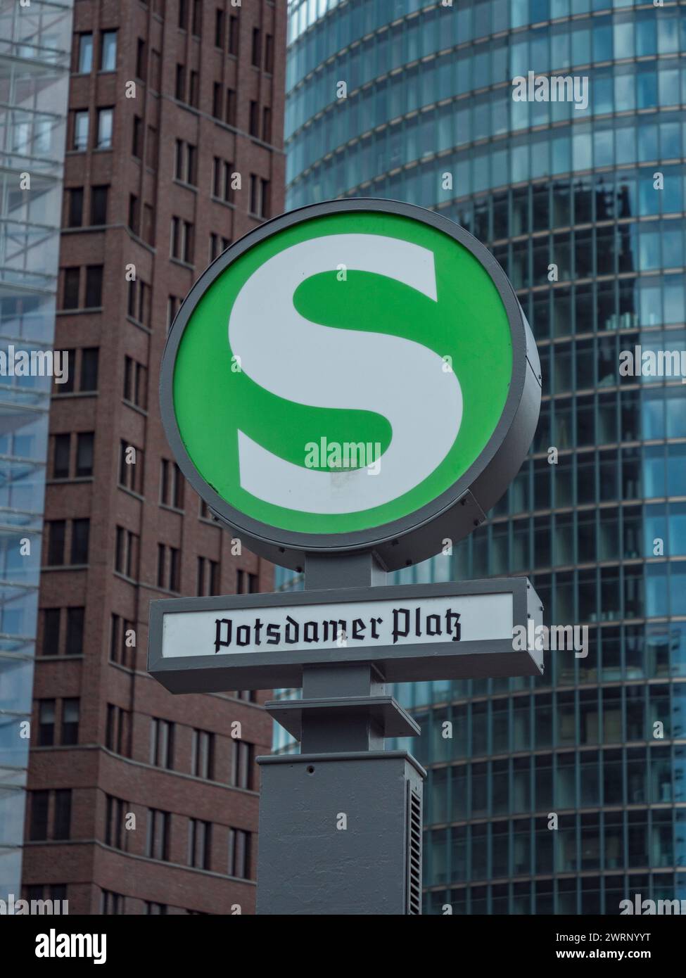 The S-Bahn logo on a signpost outside Potsdamer Platz station in Berlin ...