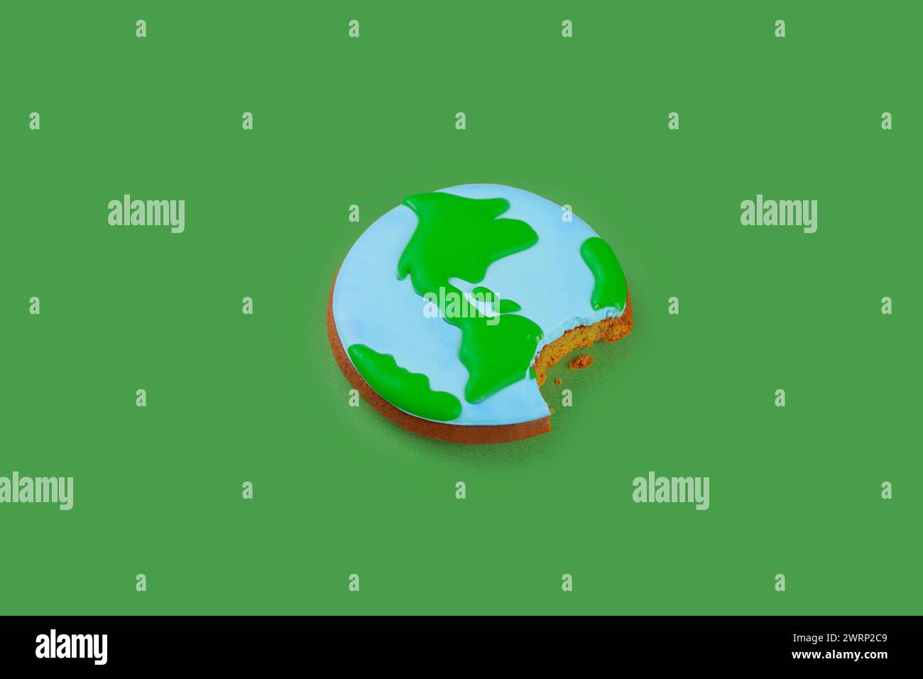 Earth Day and Environmental problems concept. Сookie in shape of Earth ...