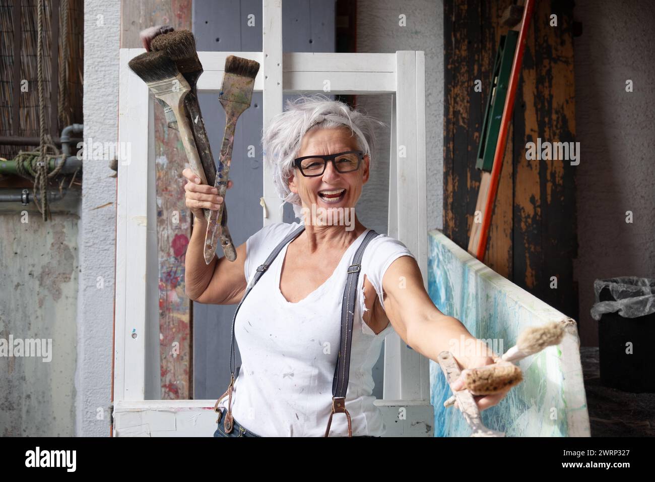 smiling laughing happy older mature woman portrait, proud artist, in ...