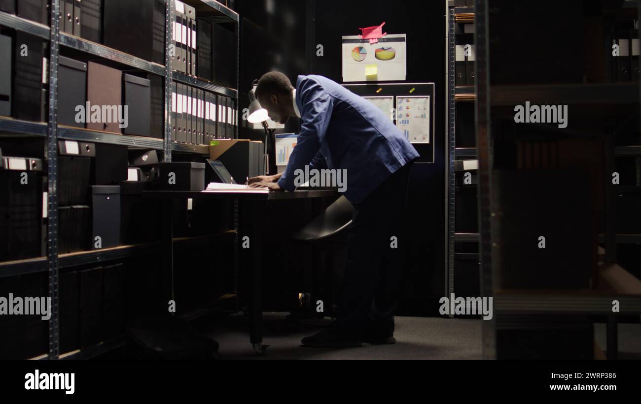 Male inspector collecting clues, analyzing statements, and utilising ...