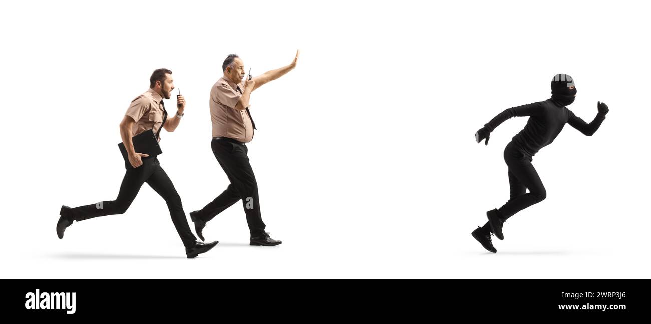 Full length profile shot of policemen chasing a thief in disguise ...