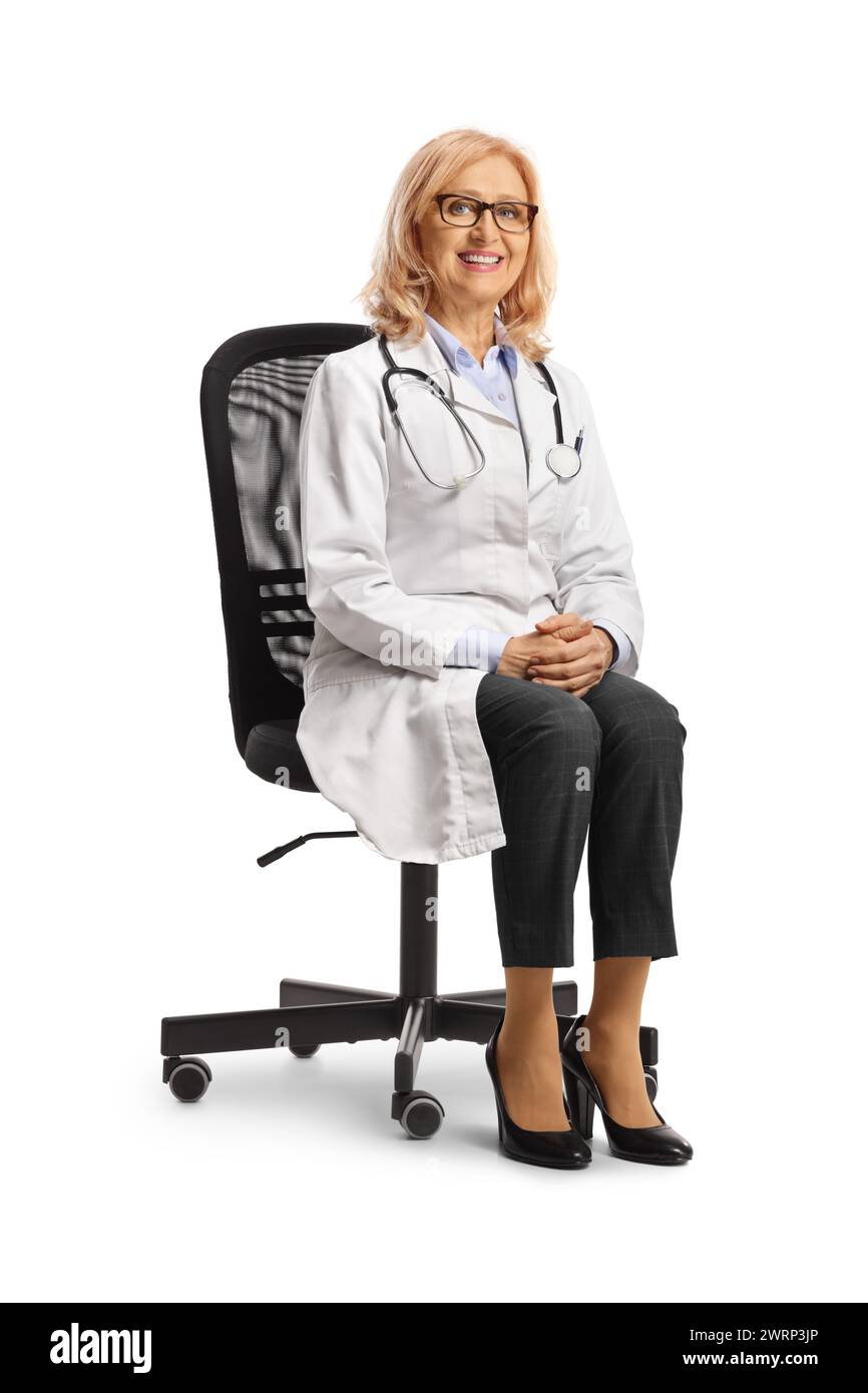 Female doctor sitting in an office chair and smiling isolated on white ...