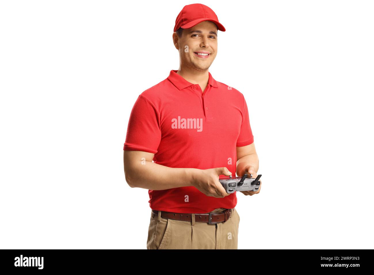 Drone operator holding a remote controller and smiling isolated on ...