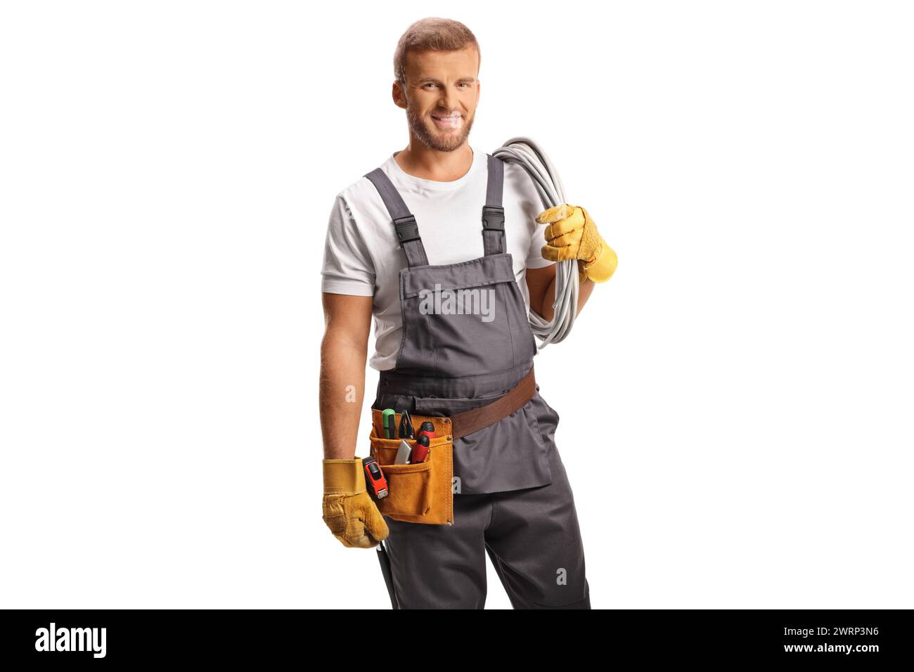 Electrician in a uniform carrying cables on his shoulder isolated on ...