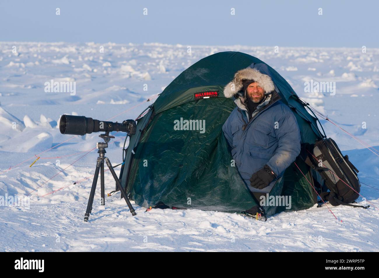 Photographer Steven Kazlowski with camera tripod and Hilleberg tent ...