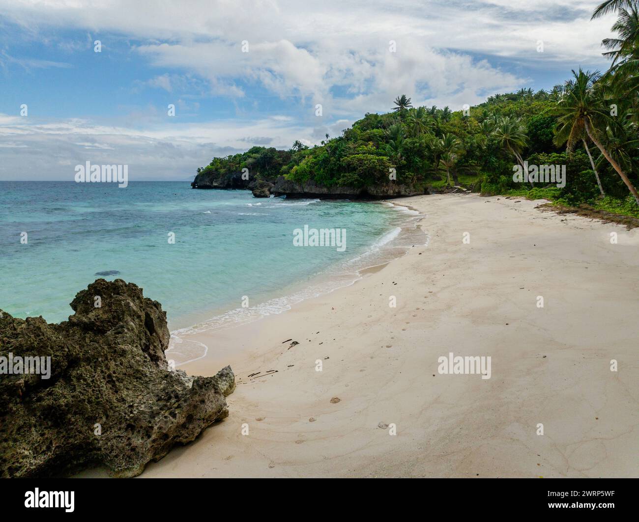 Beautiful landscape of beach with palm trees. Carabao Island. Blue sky ...