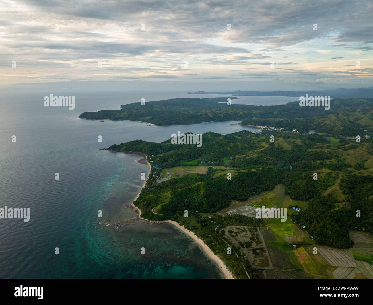 Island with mountain hills and paddy farmland. Santa Fe, Tablas ...