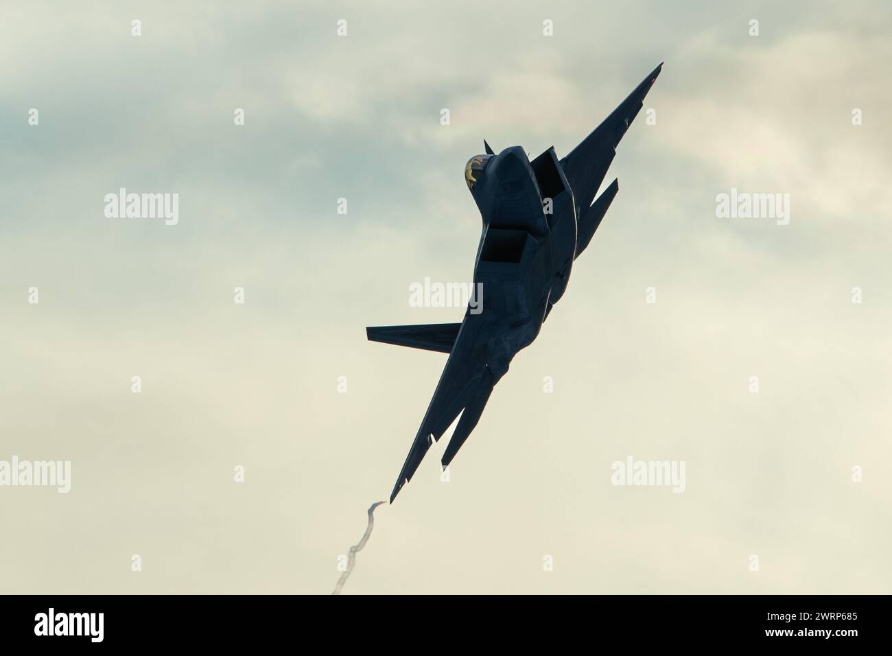 A U.S. Air Force F-22 Raptor assigned to the 3rd Wing takes off above ...