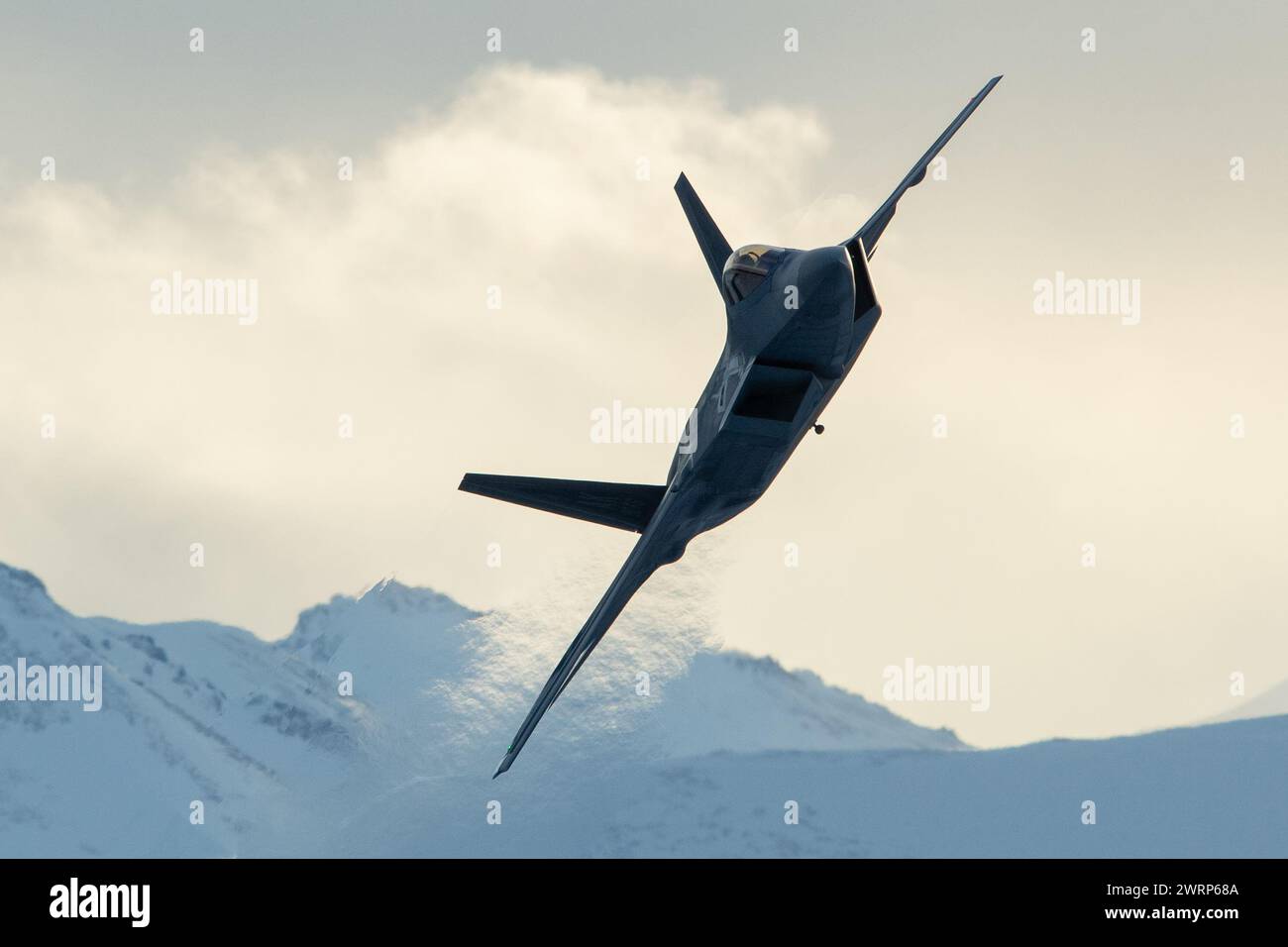 A U.S. Air Force F-22 Raptor assigned to the 3rd Wing takes off above ...