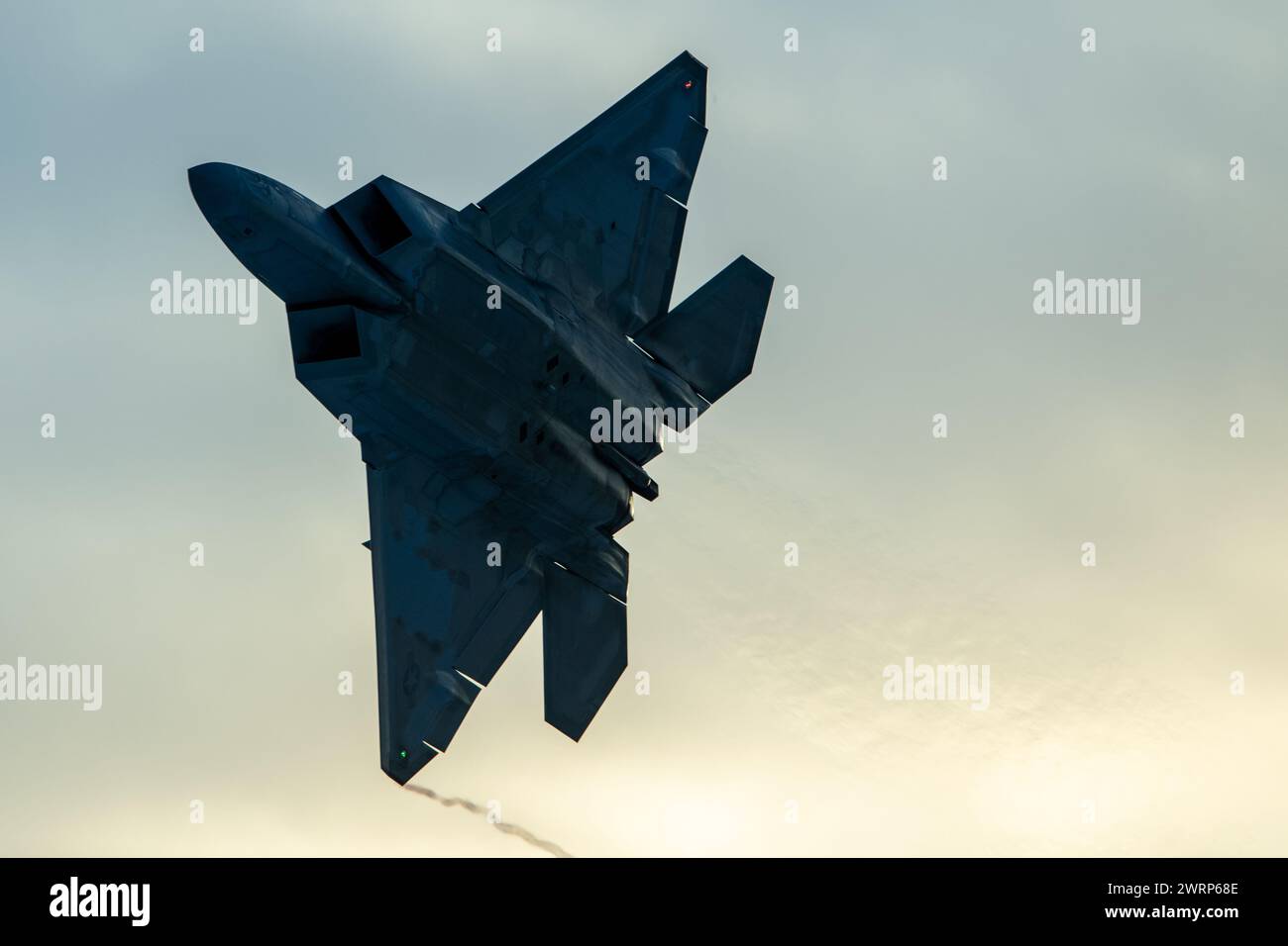 A U.S. Air Force F-22 Raptor assigned to the 3rd Wing takes off above ...