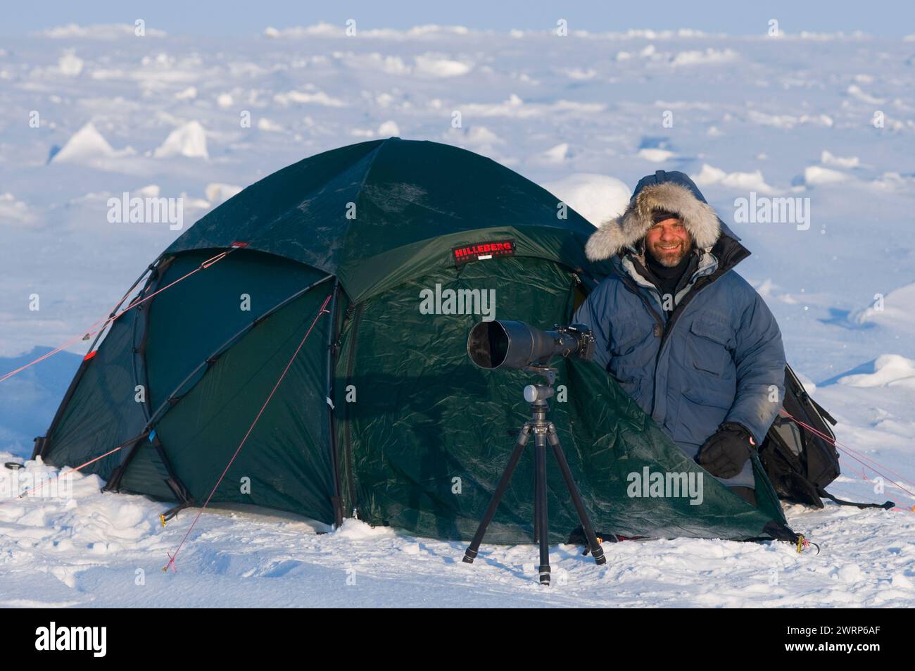 Photographer Steven Kazlowski with camera tripod and Hilleberg tent ...