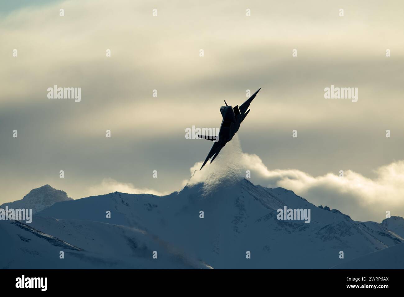 A U.S. Air Force F-22 Raptor assigned to the 3rd Wing takes off above ...