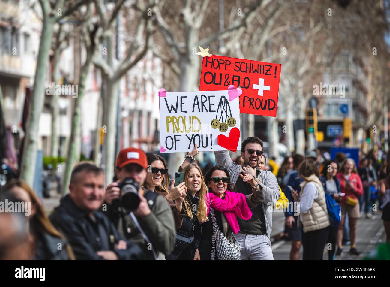 People cheering with posters at the Barcelona Marathon in 2024 Stock ...