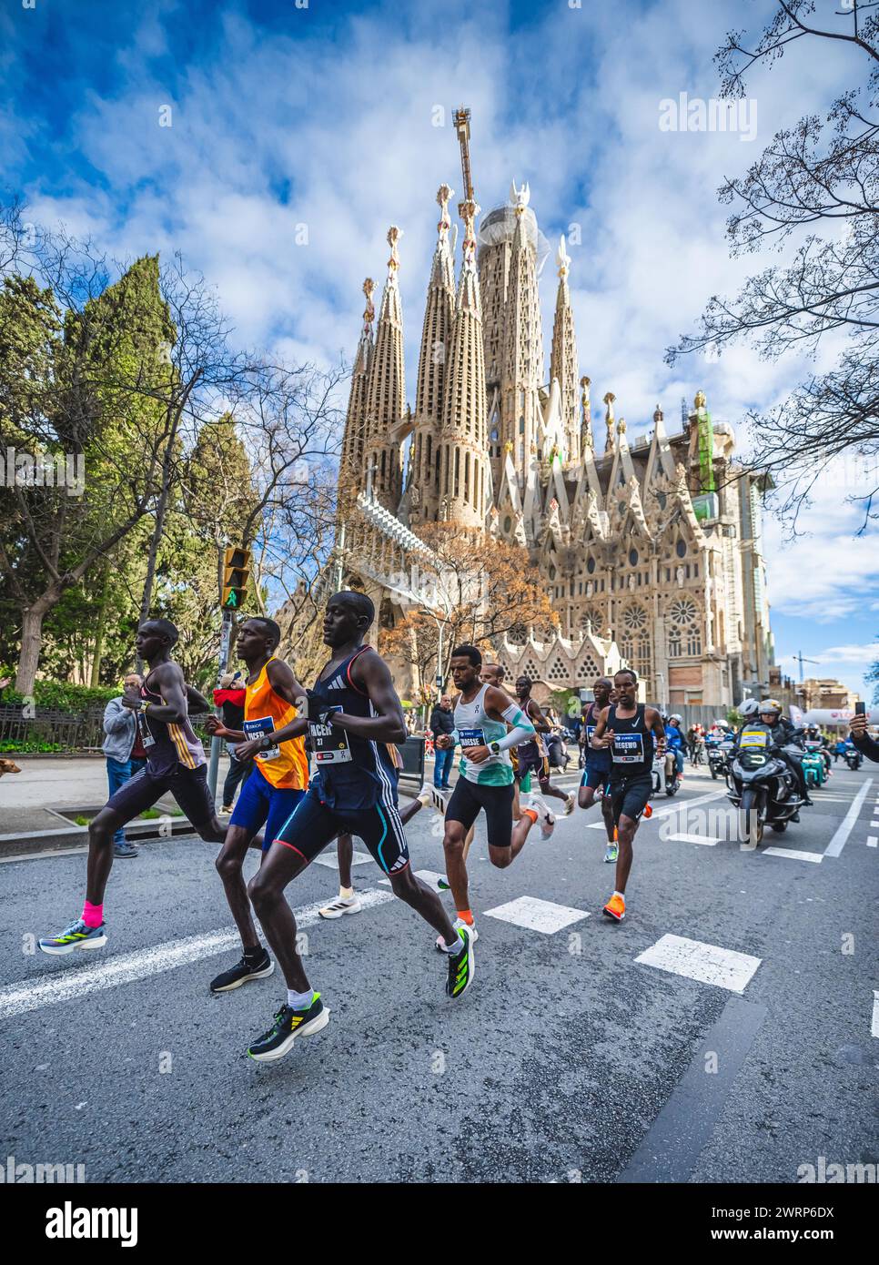 Runners with the Sagrada Familia in the background participating in the ...