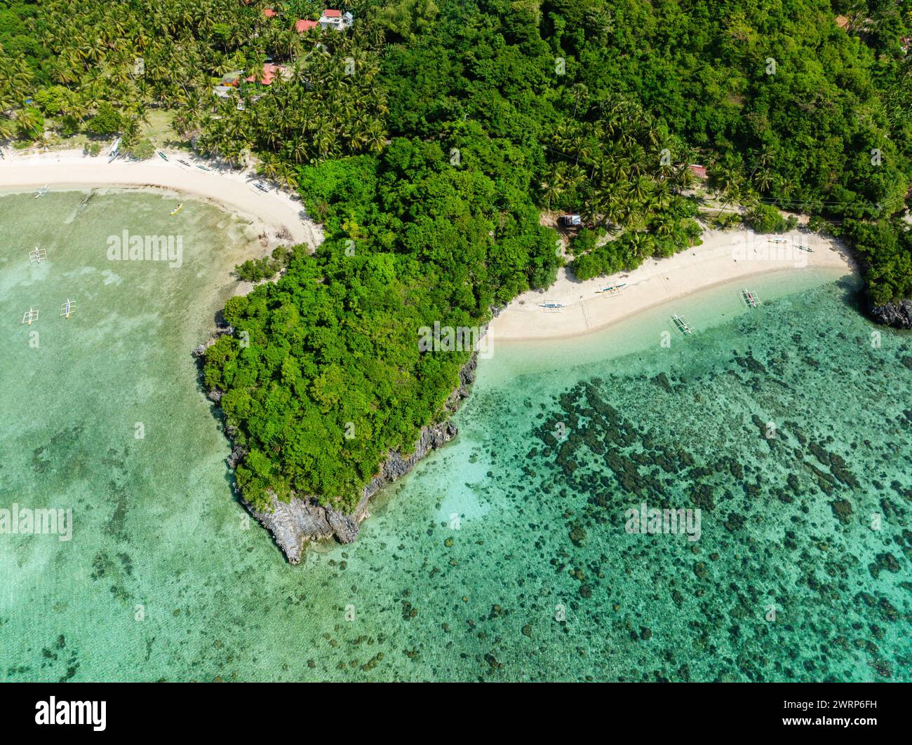 Boats floating over turquoise water and beach with white sand in ...