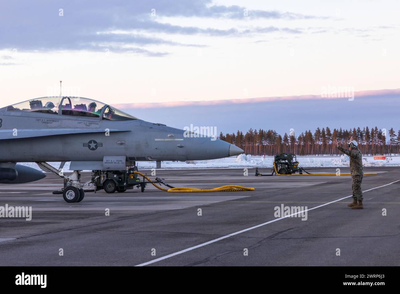 U.S. Marine Corps Sgt. Levi Brus, right, a native of Nebraska and an ...