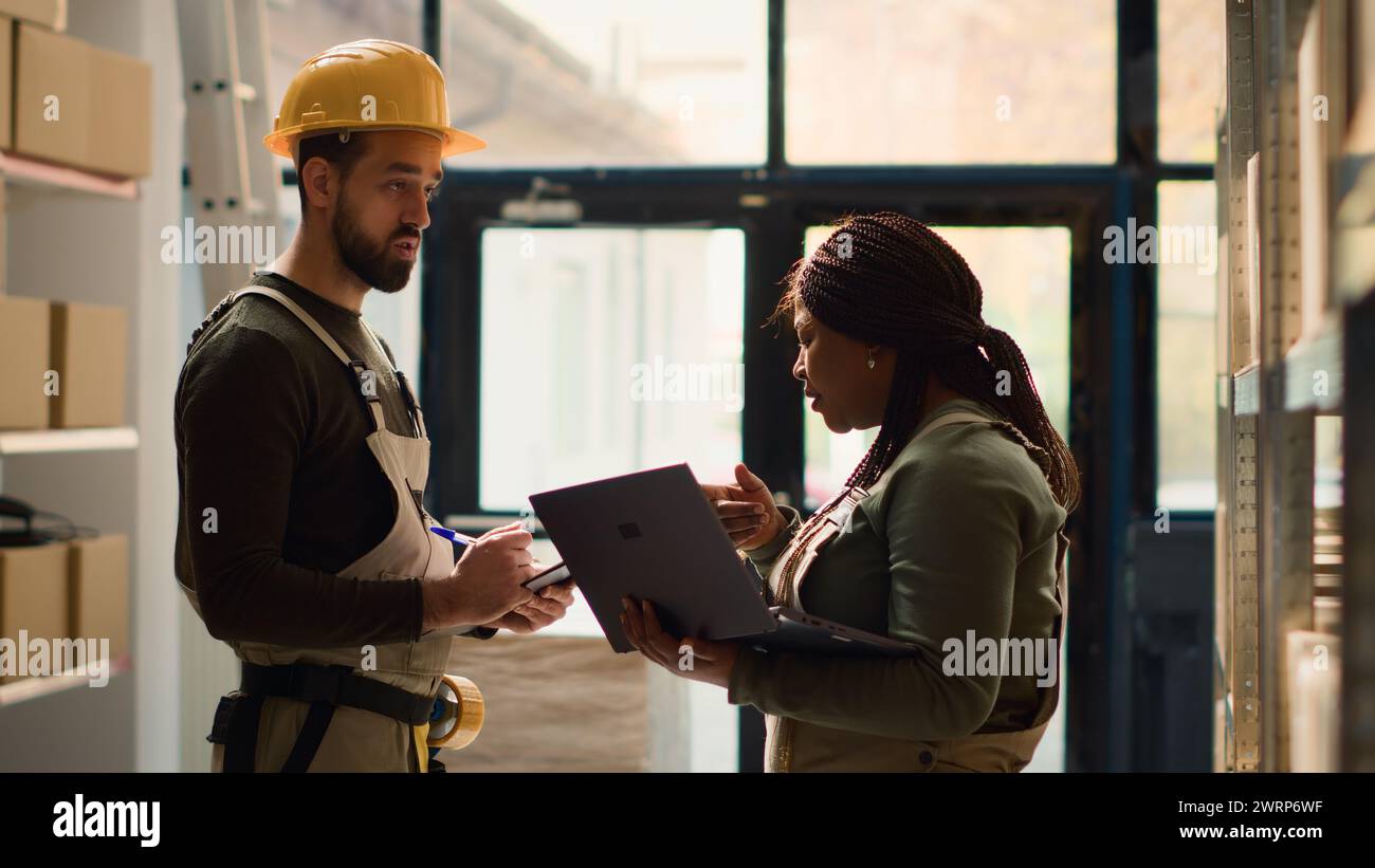 Chief operations officer and worker perform warehouse inventory ...