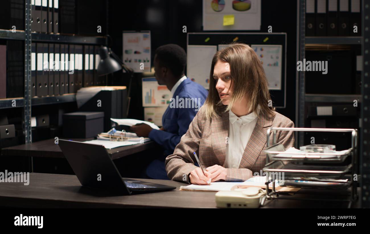 Caucasian detective inspector arrives for investigation with files ...