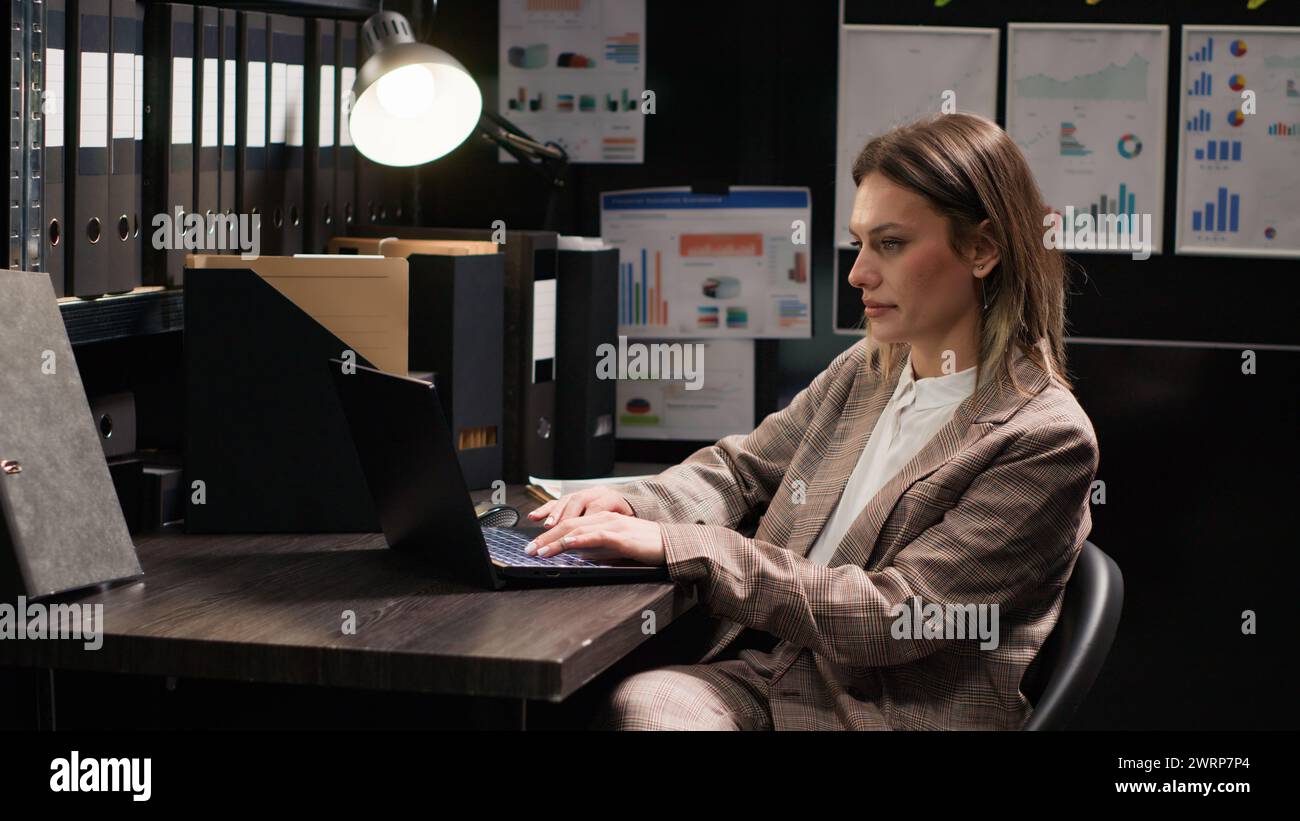 Forensic investigator focused female hi-res stock photography and ...
