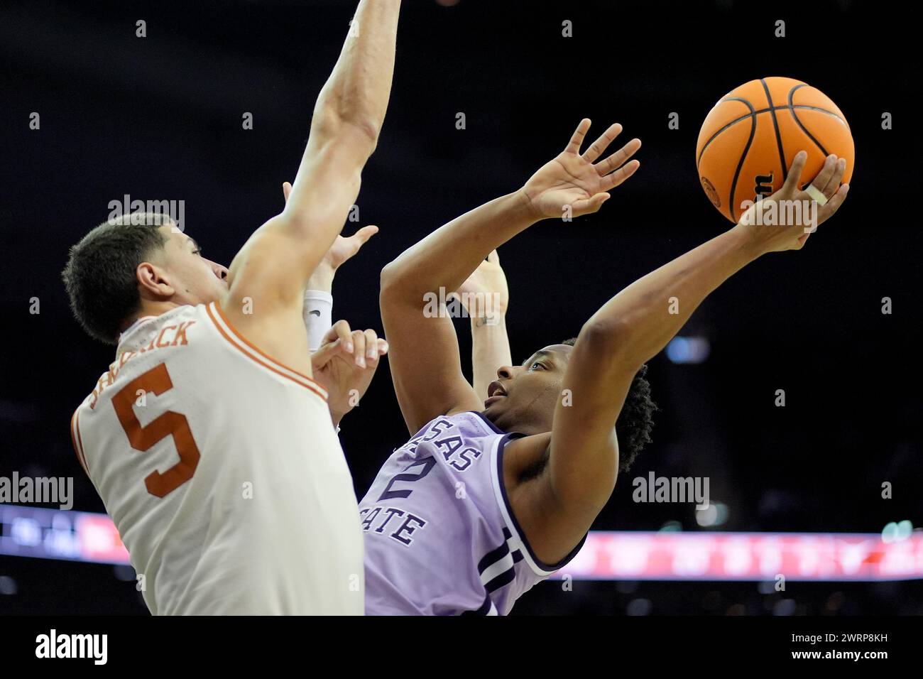 Kansas State guard Tylor Perry (2) shoots under pressure from Texas ...