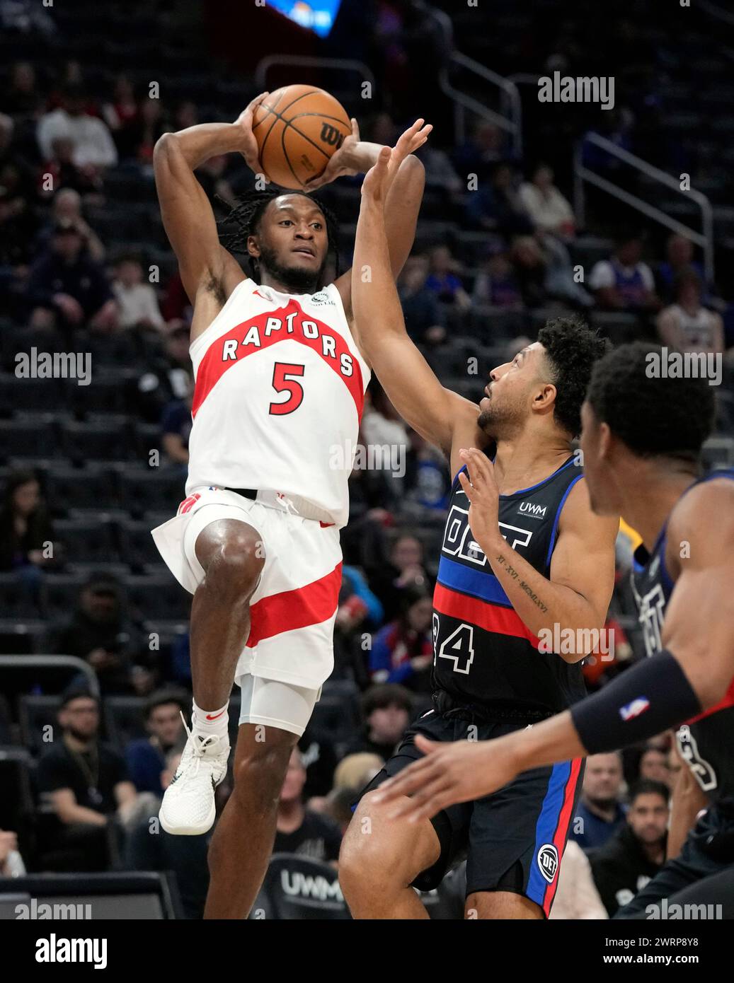 Toronto Raptors guard Immanuel Quickley (5) looks to pass as Detroit ...