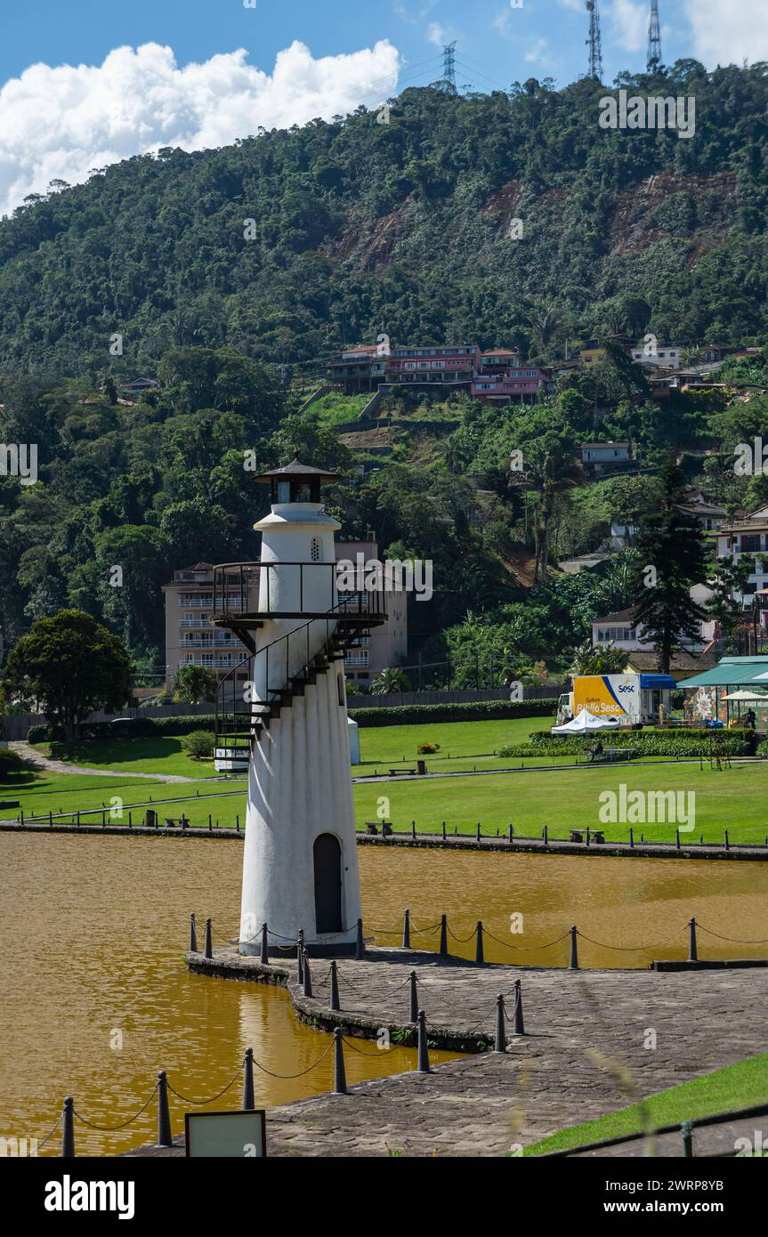 A small decorative lighthouse at a short pier at Quitandinha Palace ...