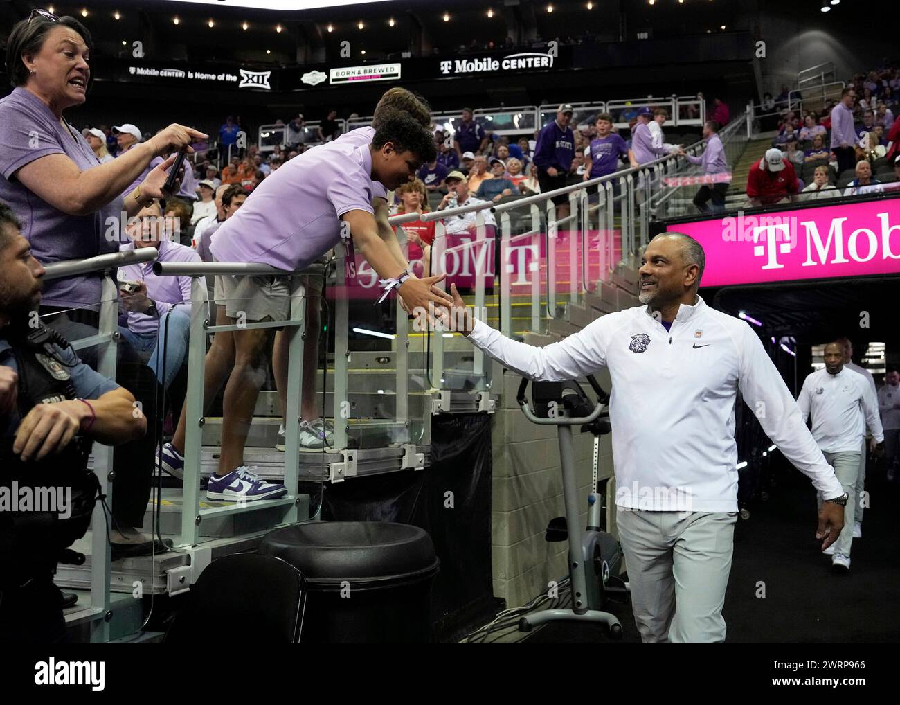 MAR 13 2024: KSU coach Jerome Tang is greeted by fans in the Big 12 Championship Tournament at T ...