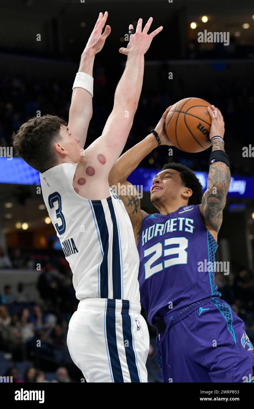 Charlotte Hornets guard Tre Mann (23) shoots against Memphis Grizzlies ...
