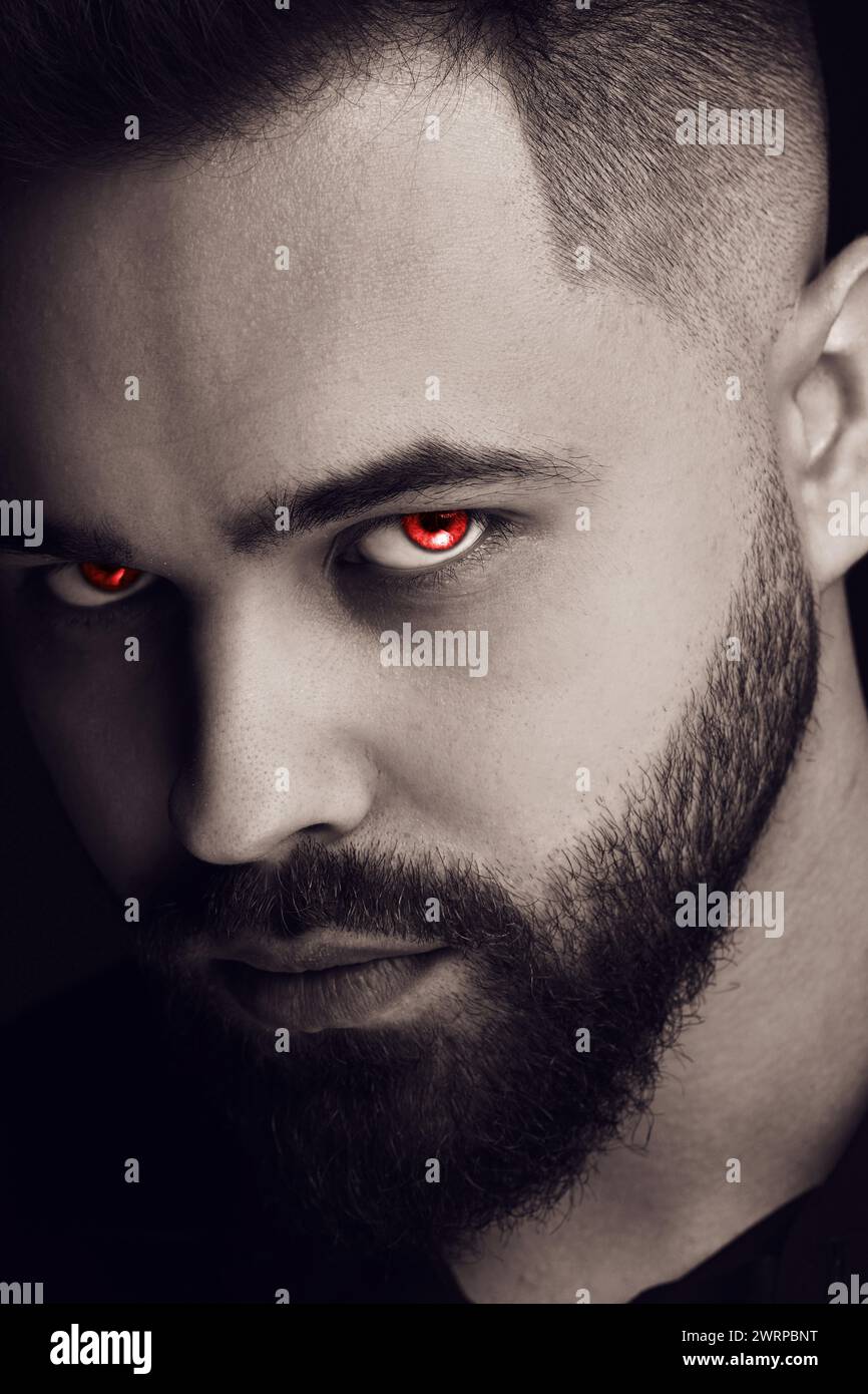 Evil eye. Man with red demonic eyes, closeup Stock Photo - Alamy