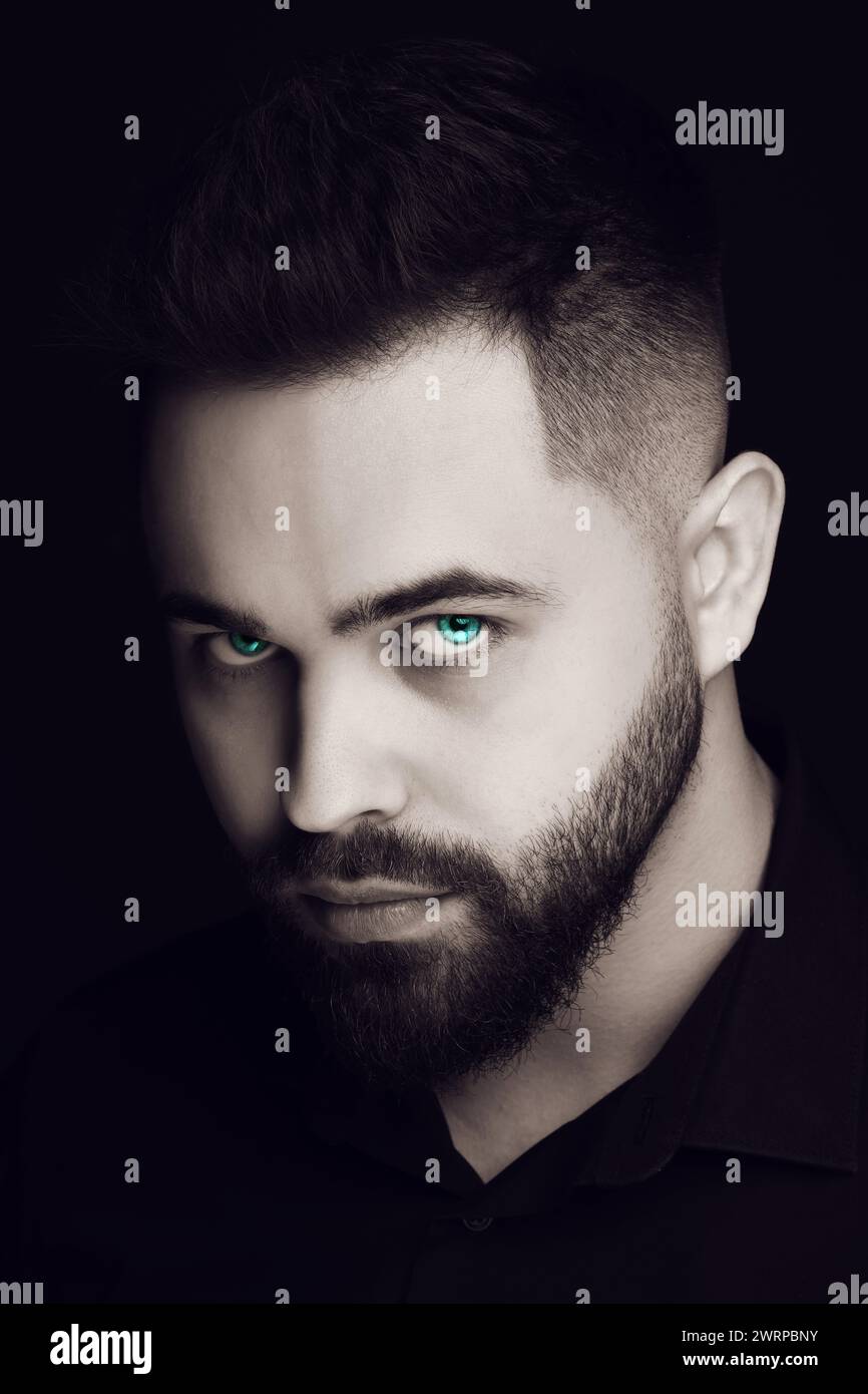 Evil eye, captivating gaze. Man with cyan eyes, closeup Stock Photo - Alamy