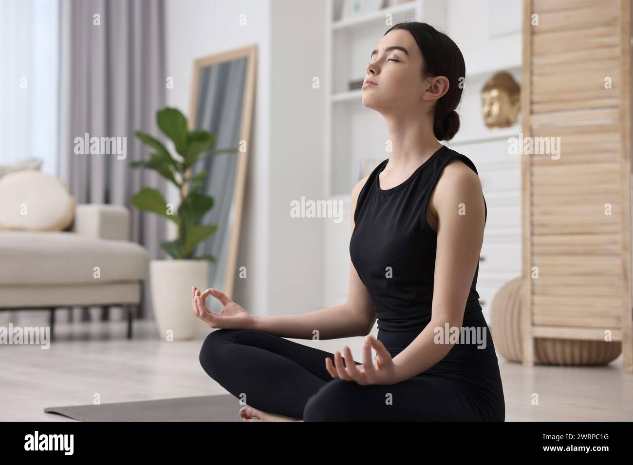 Caucasian teen girl meditating hi-res stock photography and images - Alamy
