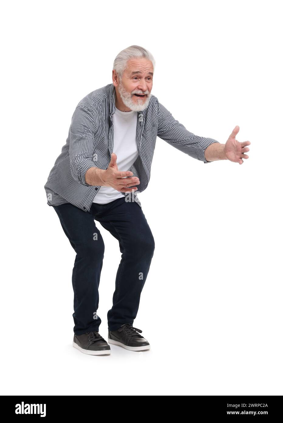 Senior man greeting someone on white background Stock Photo - Alamy