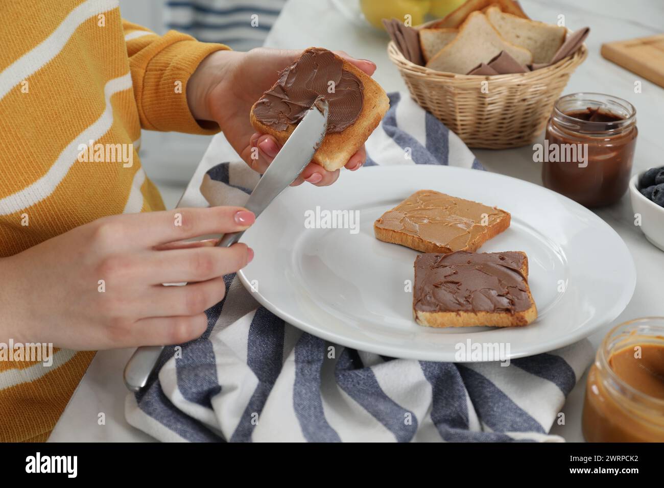 Woman spreading tasty cream hi-res stock photography and images - Alamy