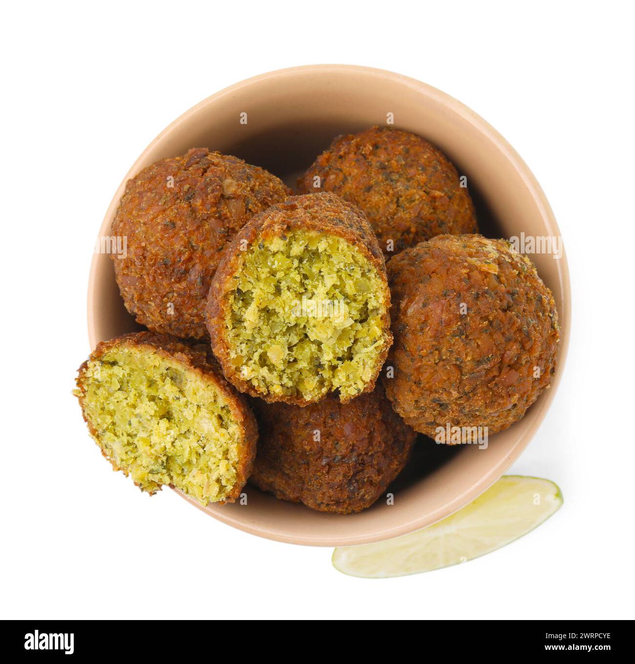 Delicious falafel balls in bowl and lime slice isolated on white, top ...