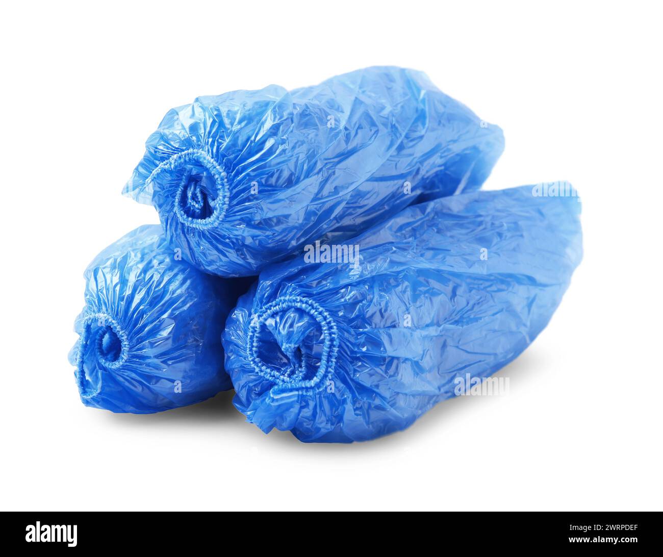 Rolled blue shoe covers isolated on white Stock Photo - Alamy