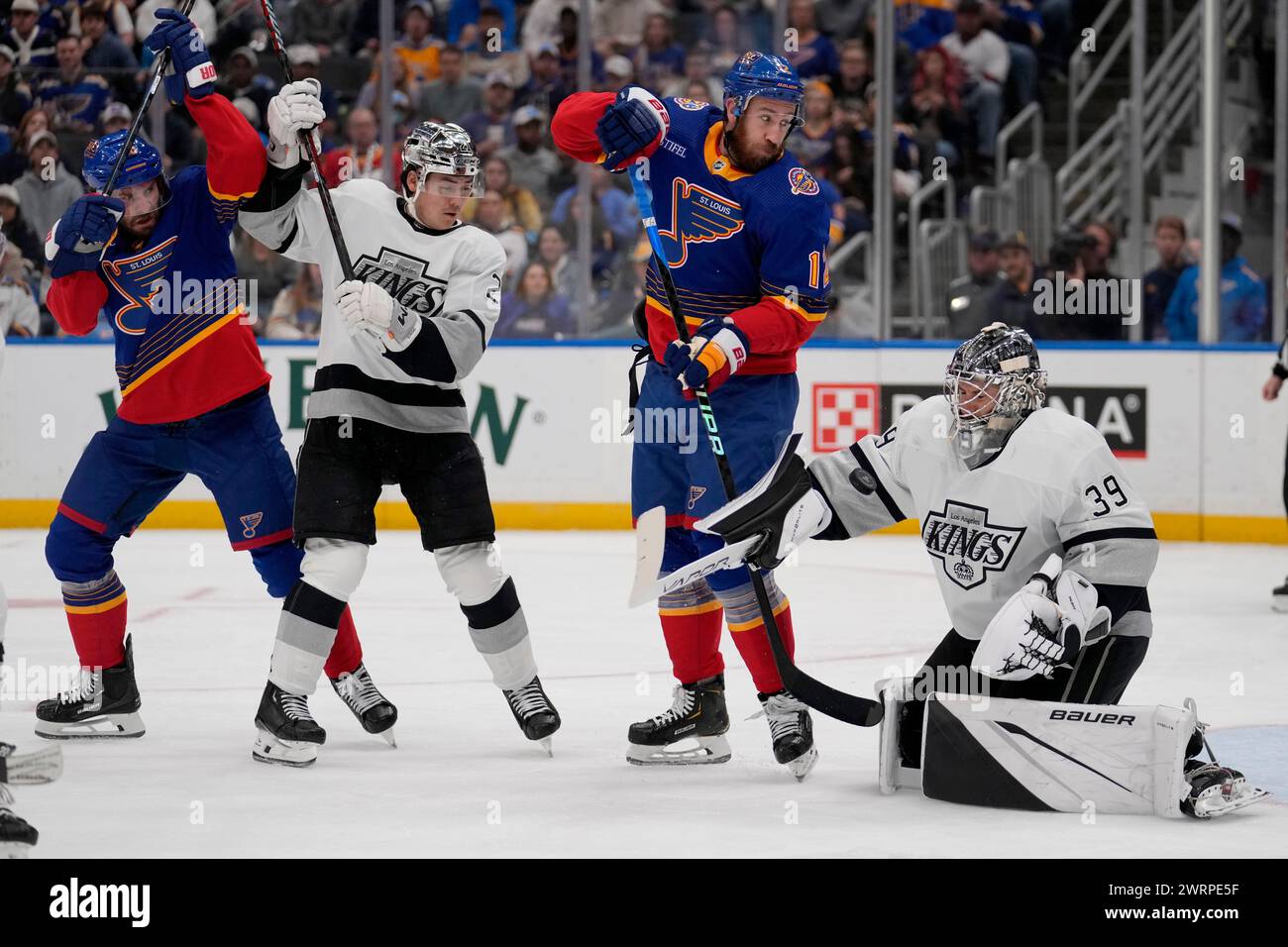 A puck bounces off Los Angeles Kings goaltender Cam Talbot (39) as ...