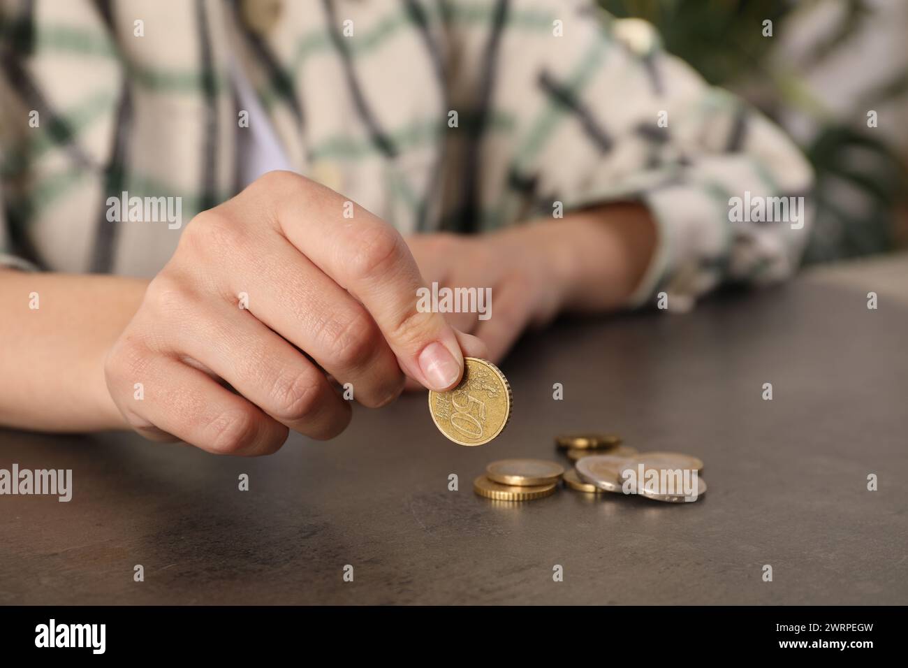 Woman counting coins hi-res stock photography and images - Alamy