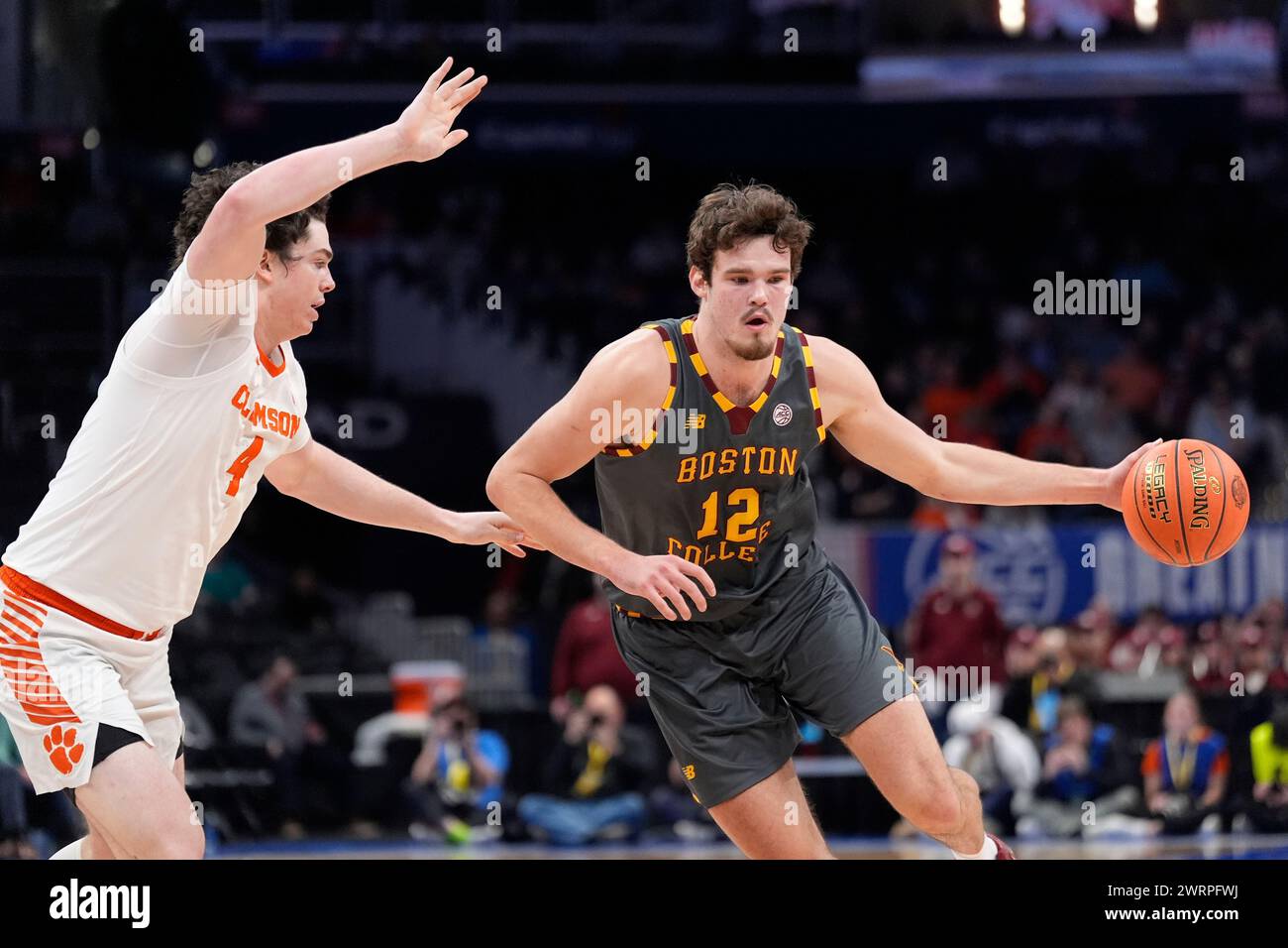 Boston College forward Quinten Post (12) drives past Clemson forward ...