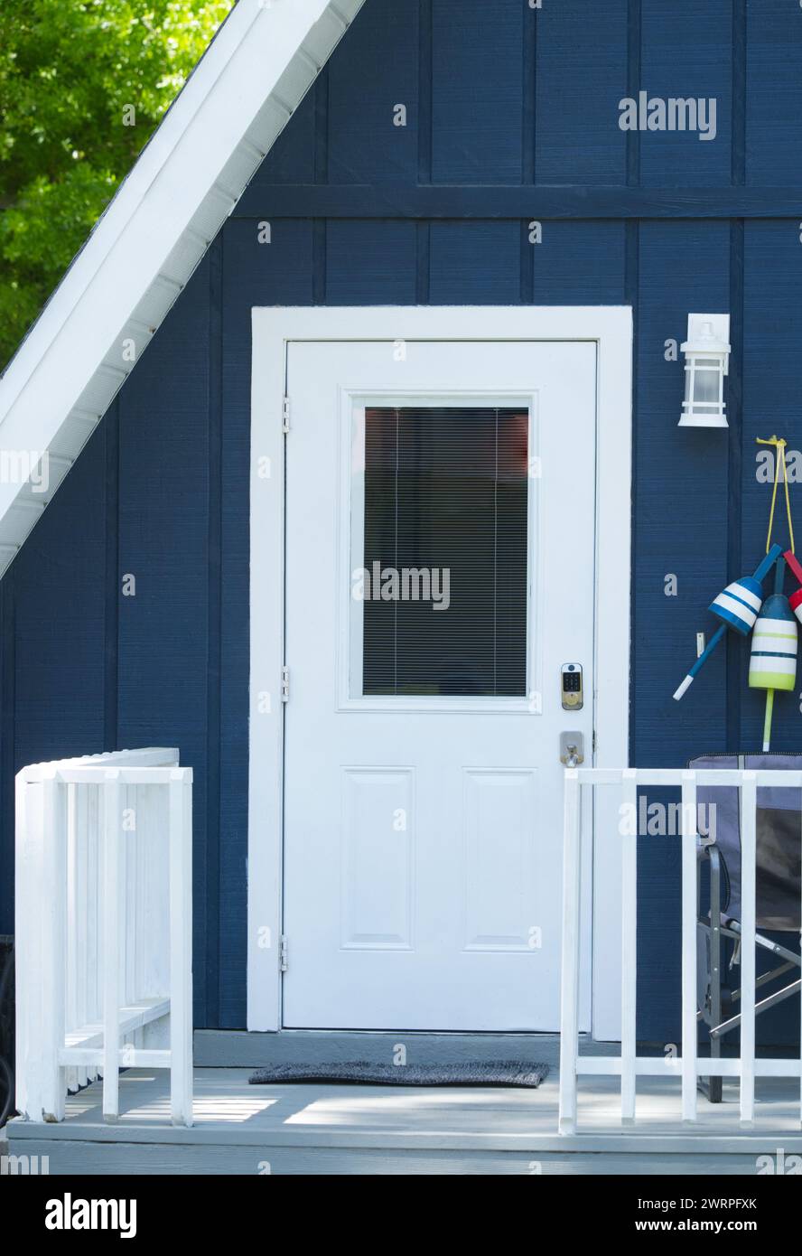 Close up of cute adorable A frame triangle shaped house or home with ...