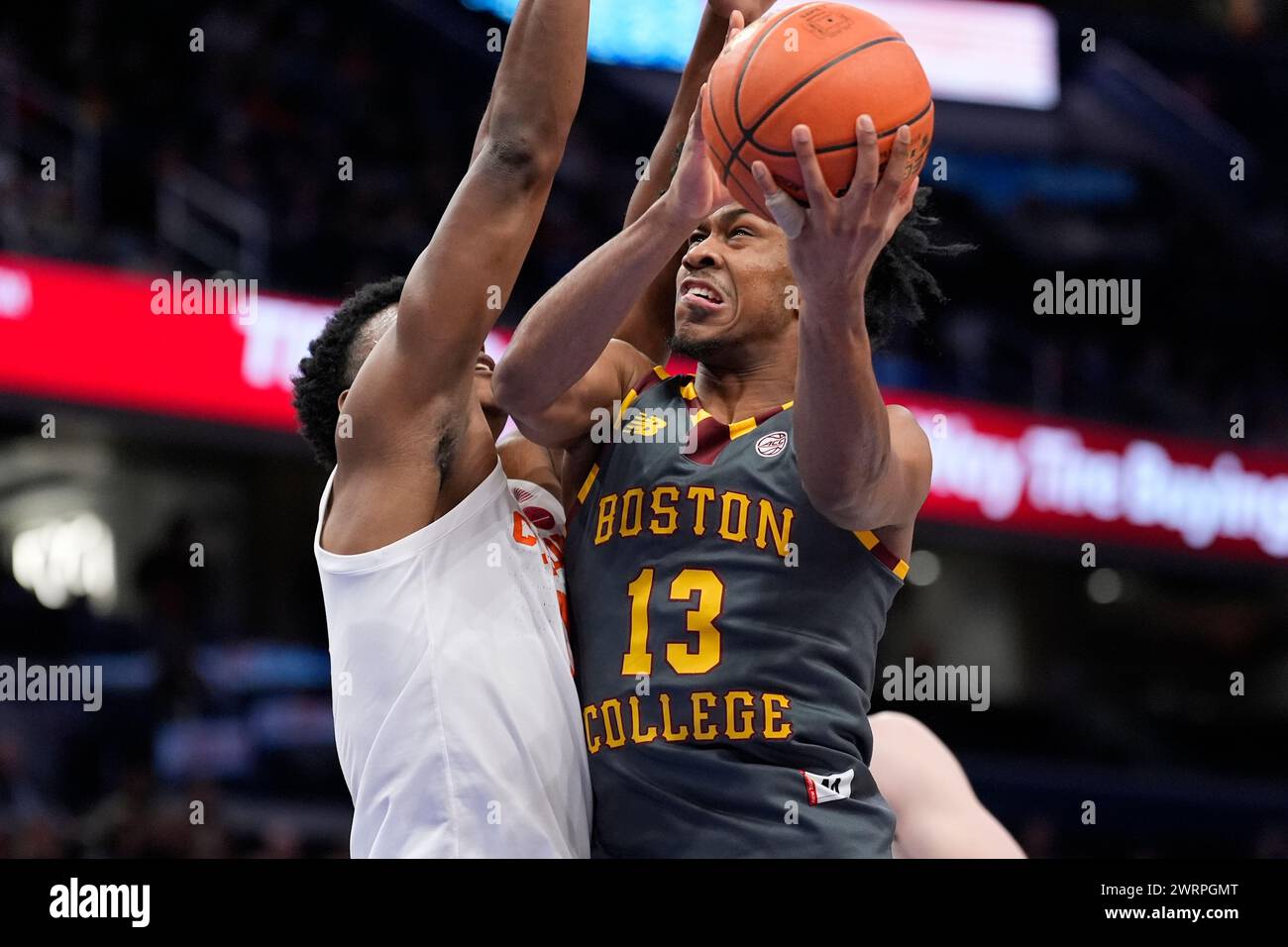 Clemson forward RJ Godfrey (10) tries to stop a shot by Boston College ...