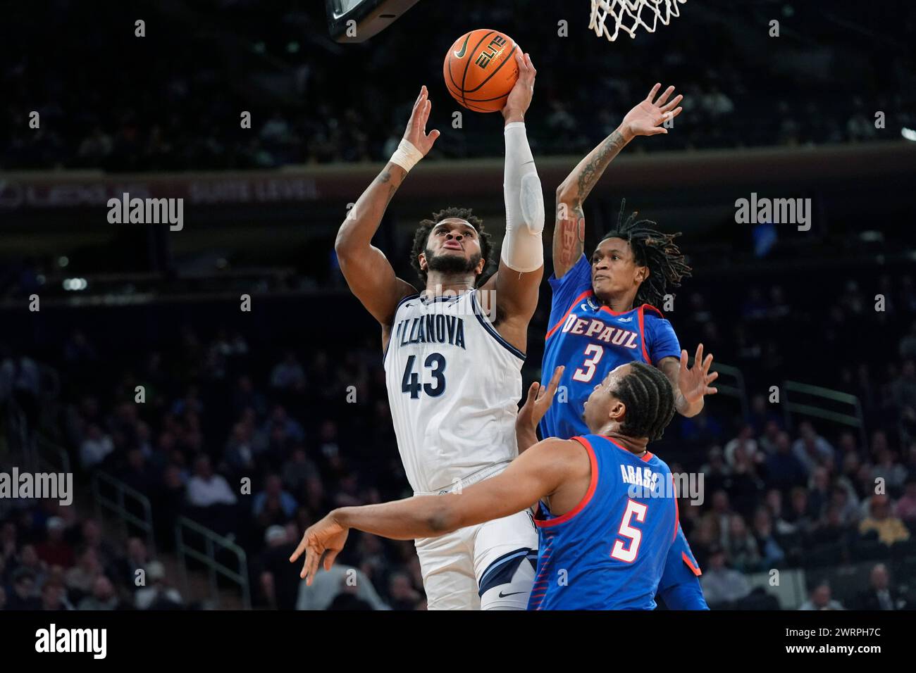 Villanova forward Eric Dixon (43) goes to the basket against DePaul ...