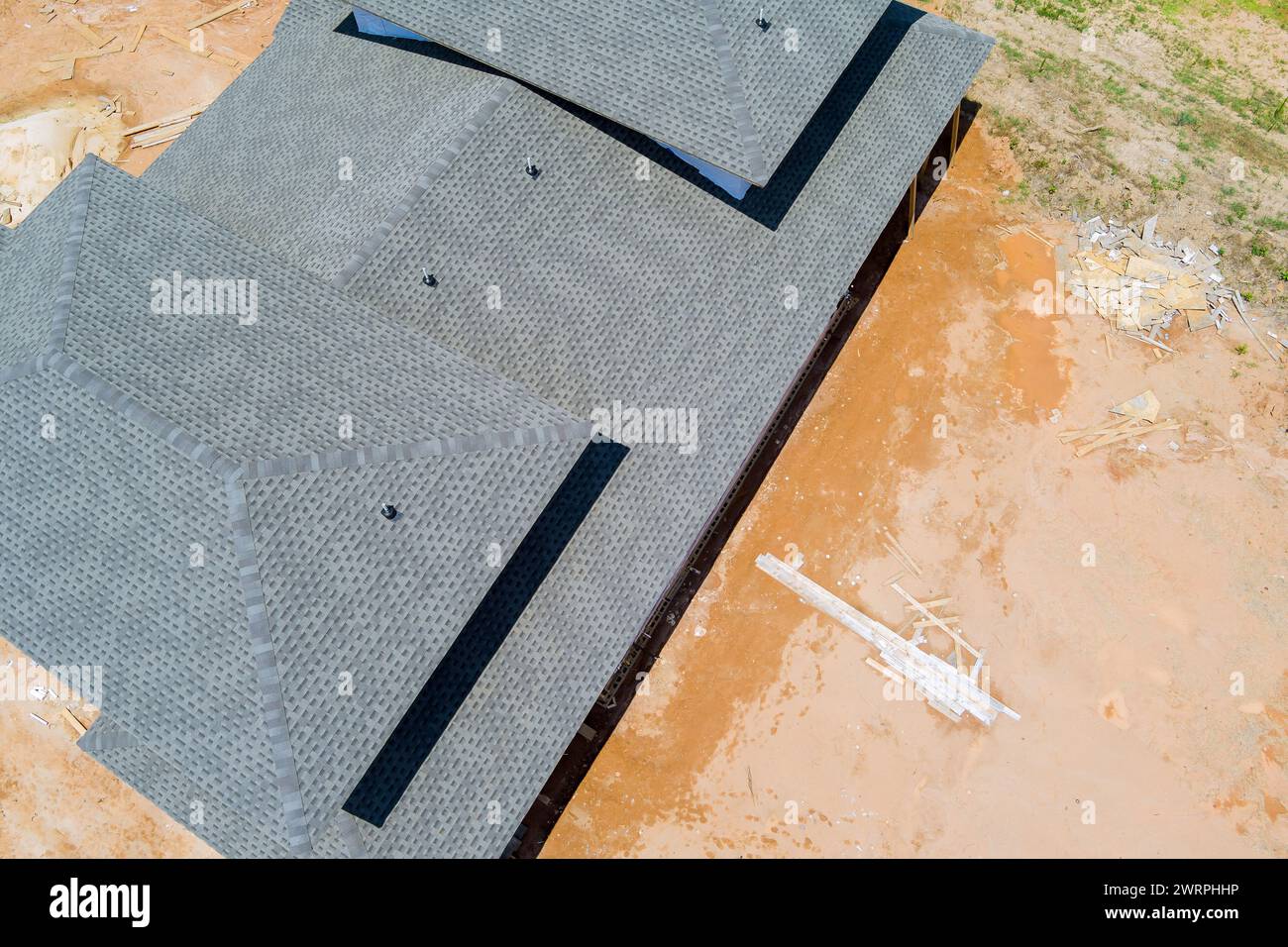 On roof top of newly constructed house, asphalt shingles are used as ...