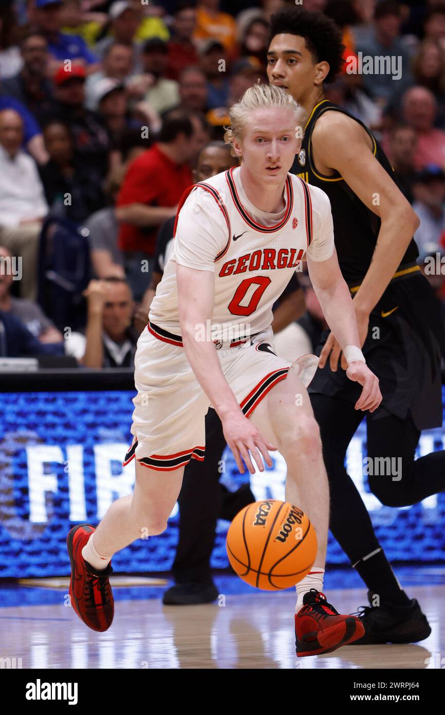 NASHVILLE, TN - MARCH 13: Georgia Bulldogs guard Blue Cain (0) dribbles ...