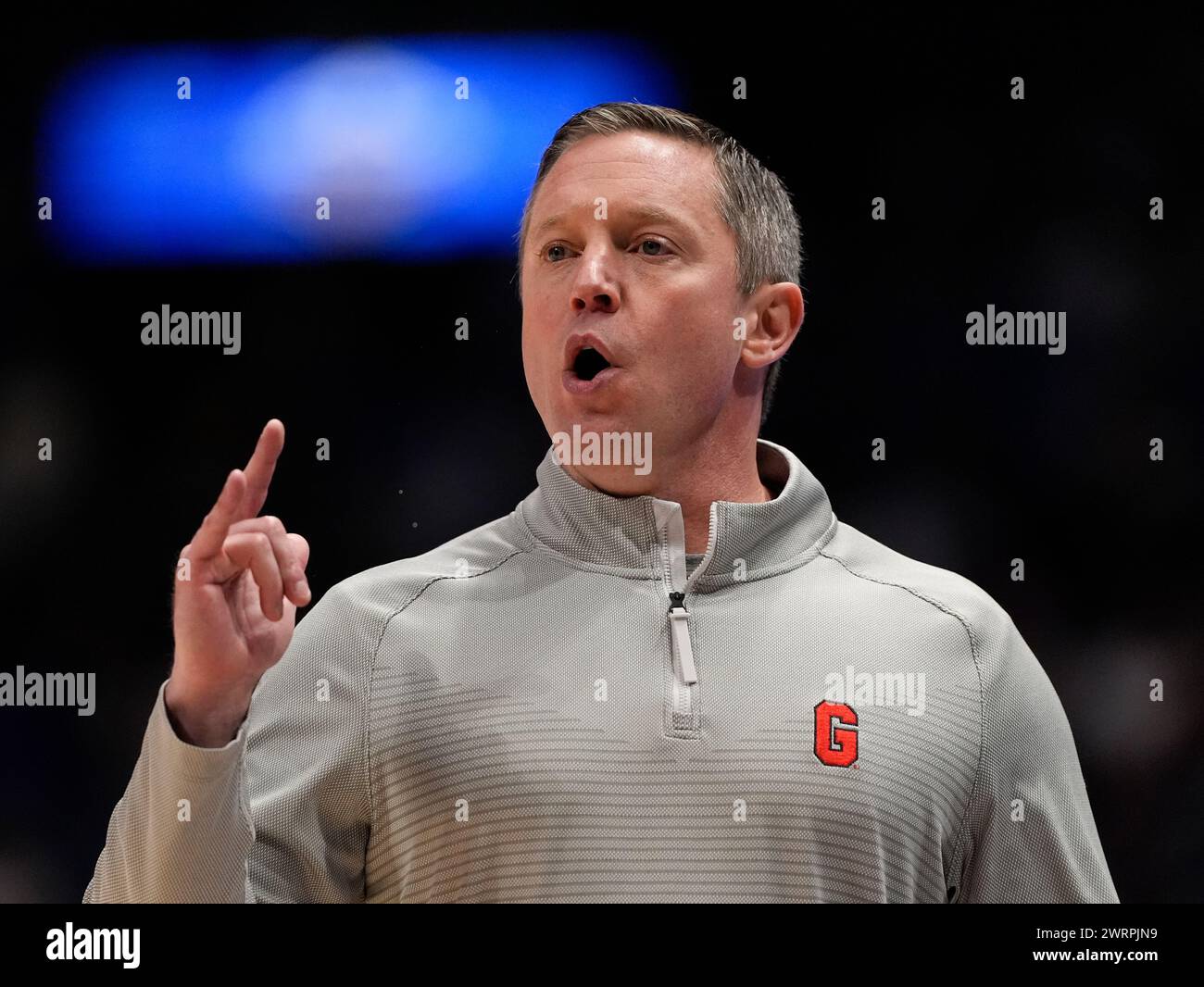 Georgia head coach Mike White talks to his players from the bench ...