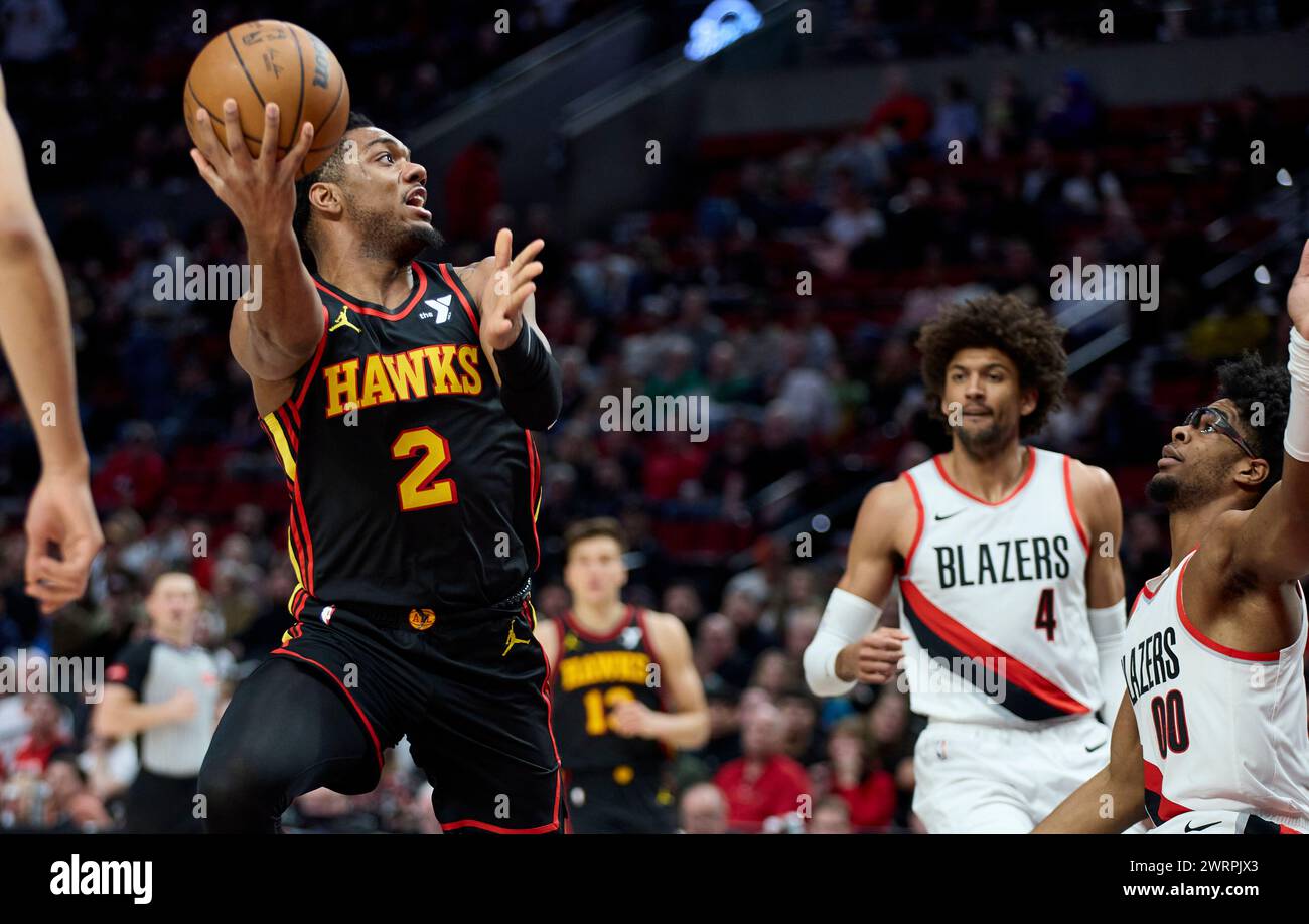Atlanta Hawks guard Trent Forrest, left, shoots over Portland Trail ...