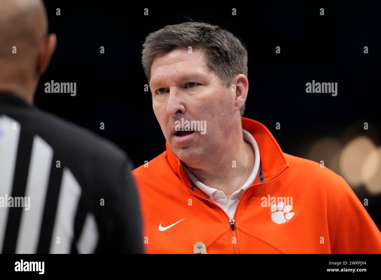 Clemson head coach Brad Brownell speaking to the game referee during ...