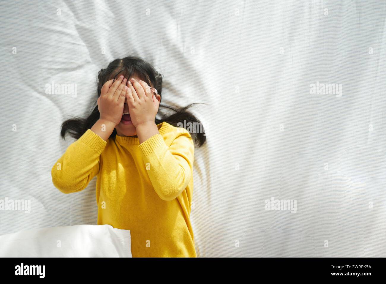 Sad child covered face hi-res stock photography and images - Alamy