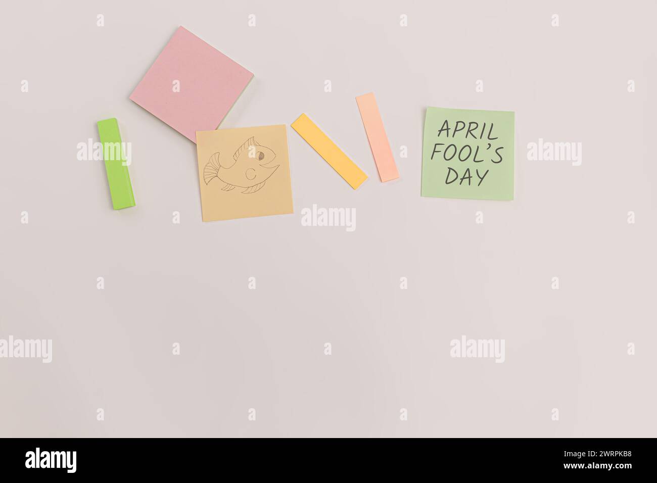 Concept of office on April Fool's Day with stationery, sticky notes on ...